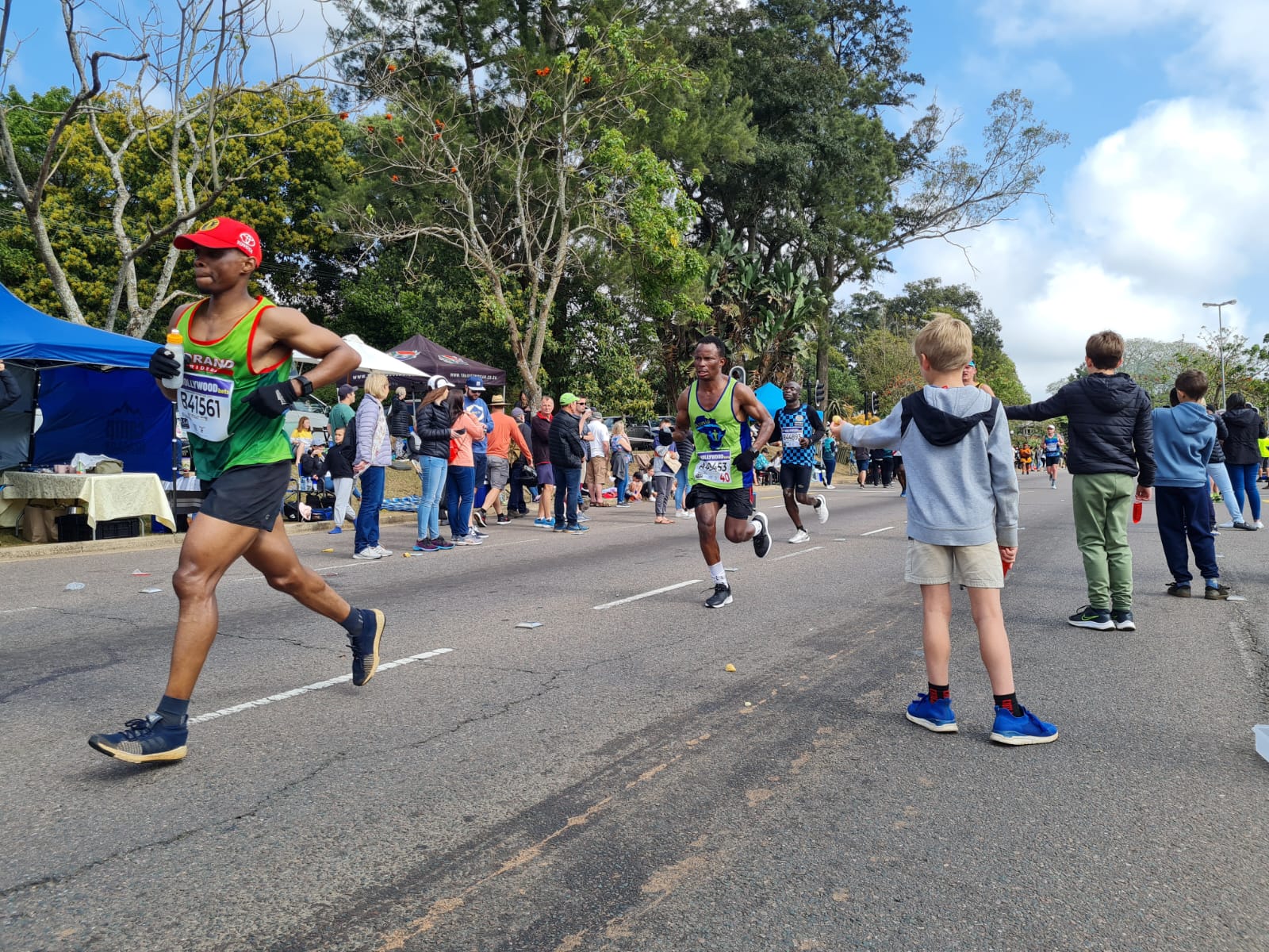 Comrades runners are streaming through enthusiastic Hillcrest ...