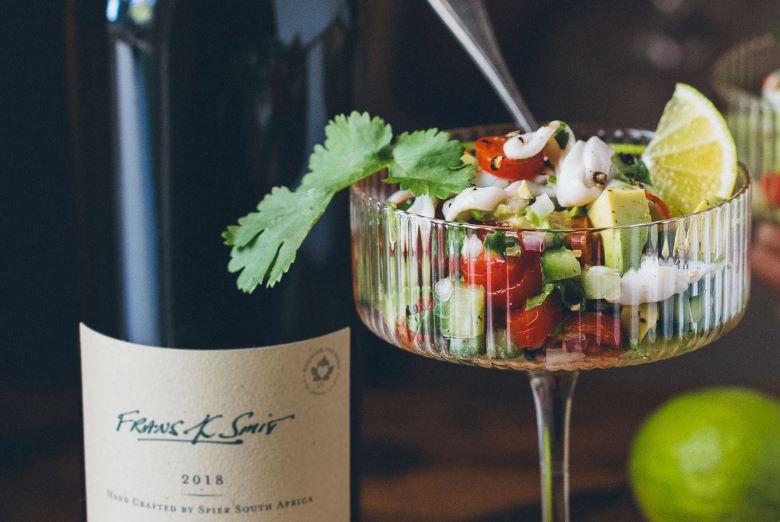 Squid Ceviche with avocado and lime served with white blend | Network News