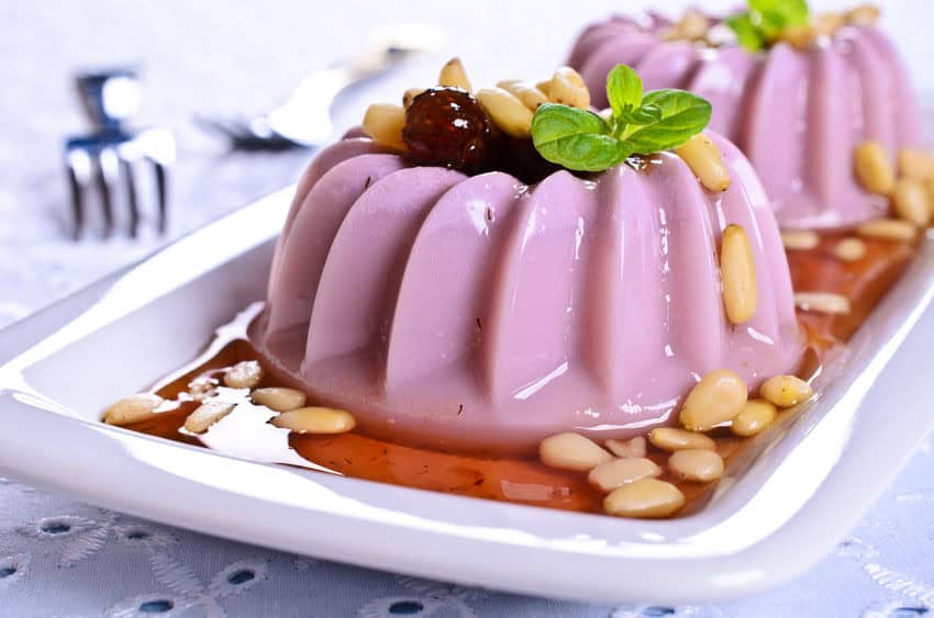Smooth milk jelly with syrup-soaked strawberries and rosewater ...