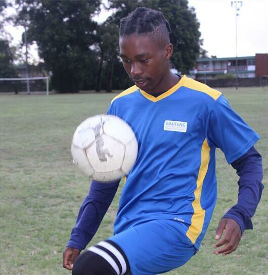 Thobani (16) aims to hit the back of the professional net